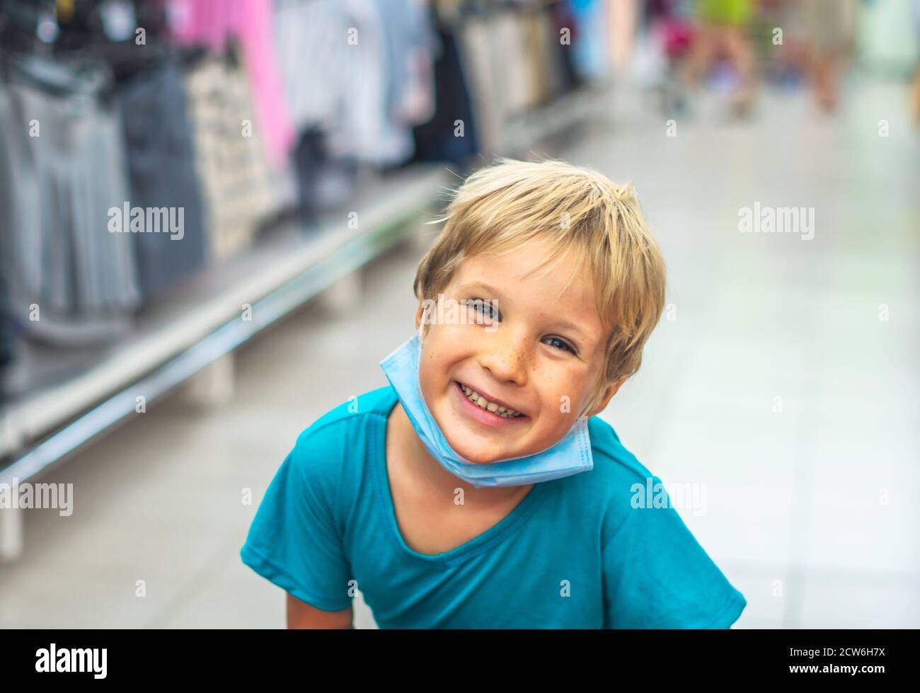 Close portrait cute smiling blue eyed freckled blond boy artistic ...