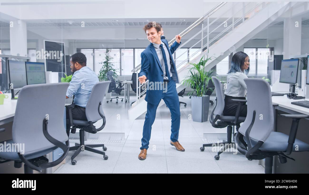 Young Cheerful Handsome Business Manager Wearing a Suit and Tie Dancing ...