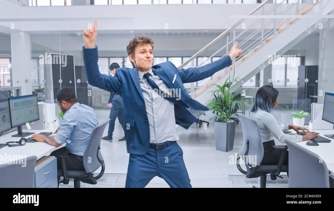 Young Cheerful Handsome Business Manager Wearing a Suit and Tie Dancing ...