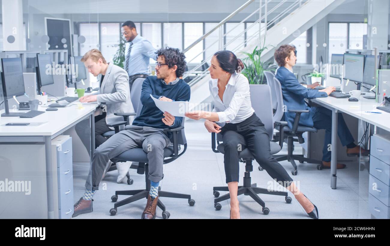 Diverse Team of Business Managers and Specialists Work on Desktop ...