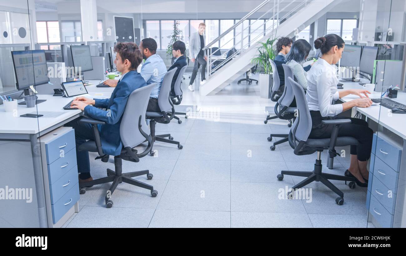 Rows of people working computers hi-res stock photography and images ...