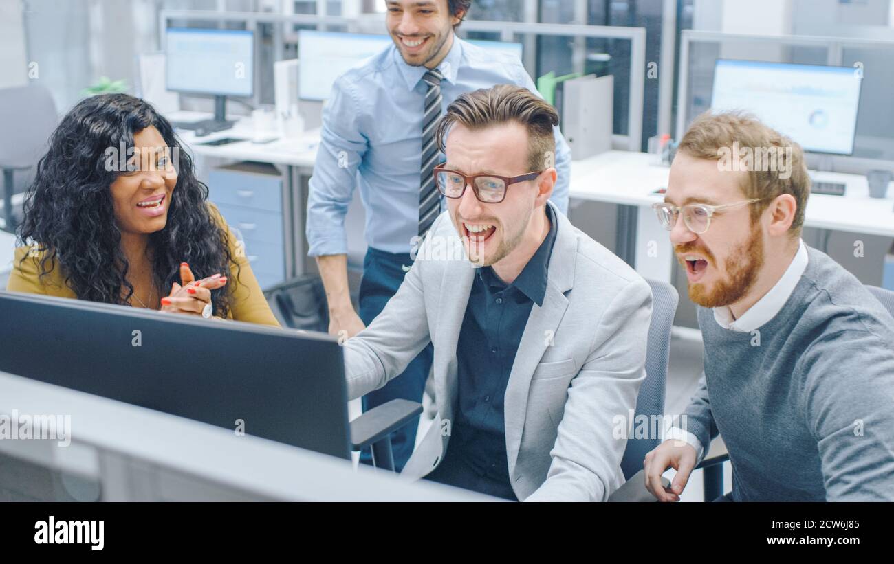 In Modern Office: Diverse Team of Businessmen and Businesswoman Work on ...