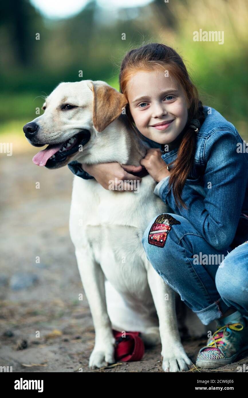 Portrait of teen girl with a dog outdoors Stock Photo - Alamy