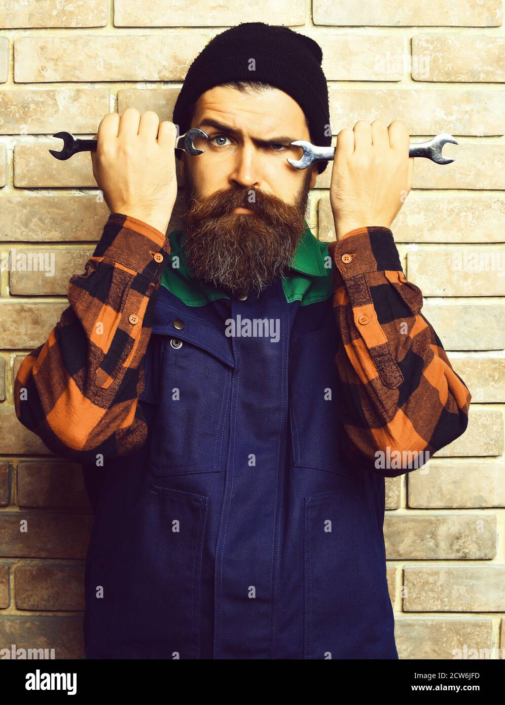 Bearded man, long beard. Brutal caucasian mechanic, unshaven hipster in ...
