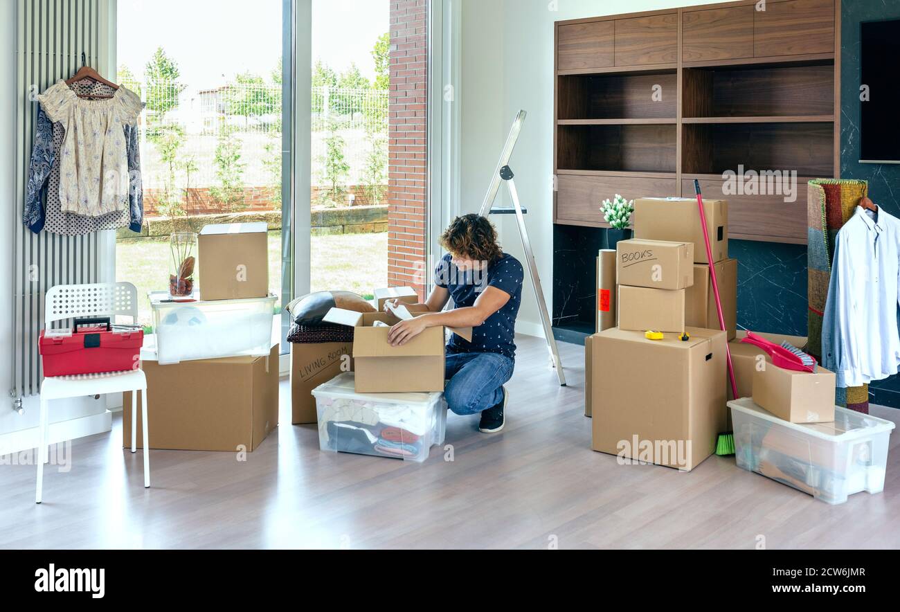 Man organizing boxes hi-res stock photography and images - Alamy