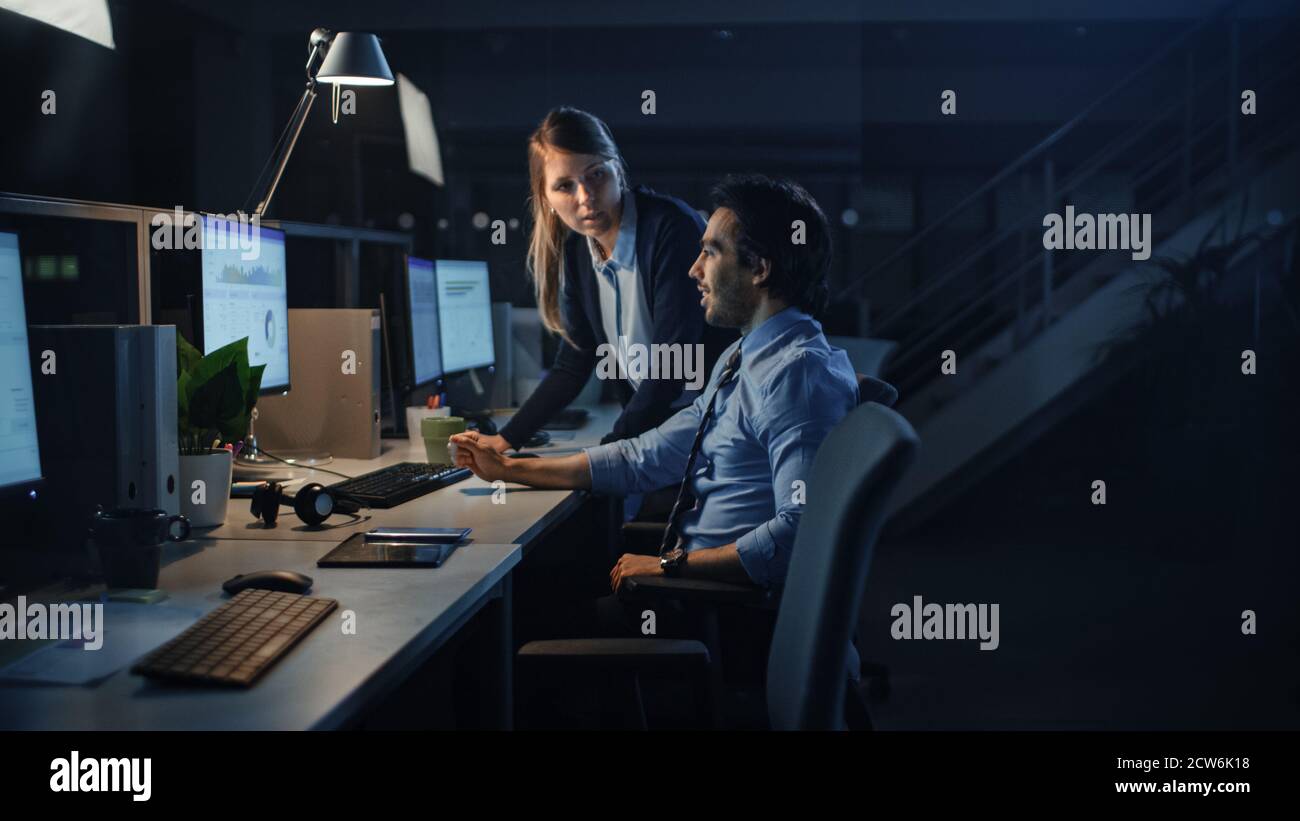 Ambitious Businessman Uses Desktop Computer, His Female Project Manager ...