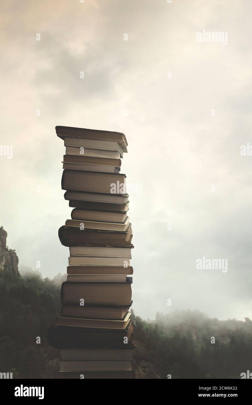 concept of power of knowledge, stack of books reaching up to the sky ...
