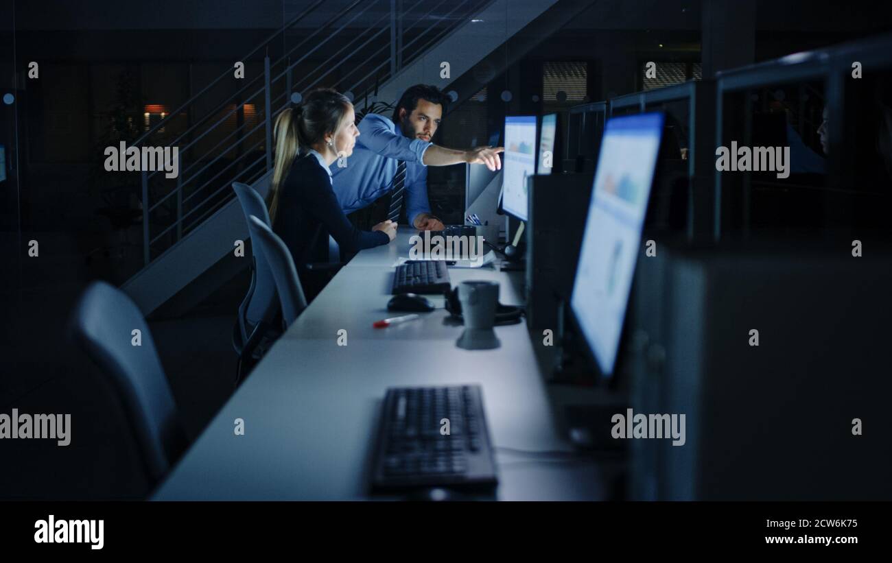 Confident Businessman Uses Desktop Computer, Her Male Manager Explains ...