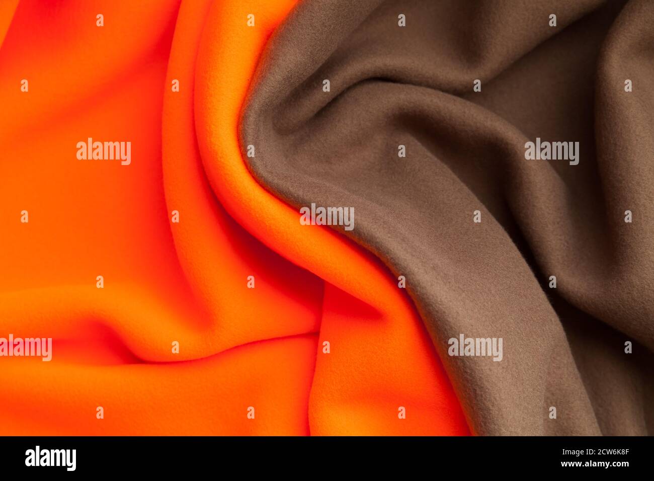 Background texture of bright orange and brown fleece, soft napped ...