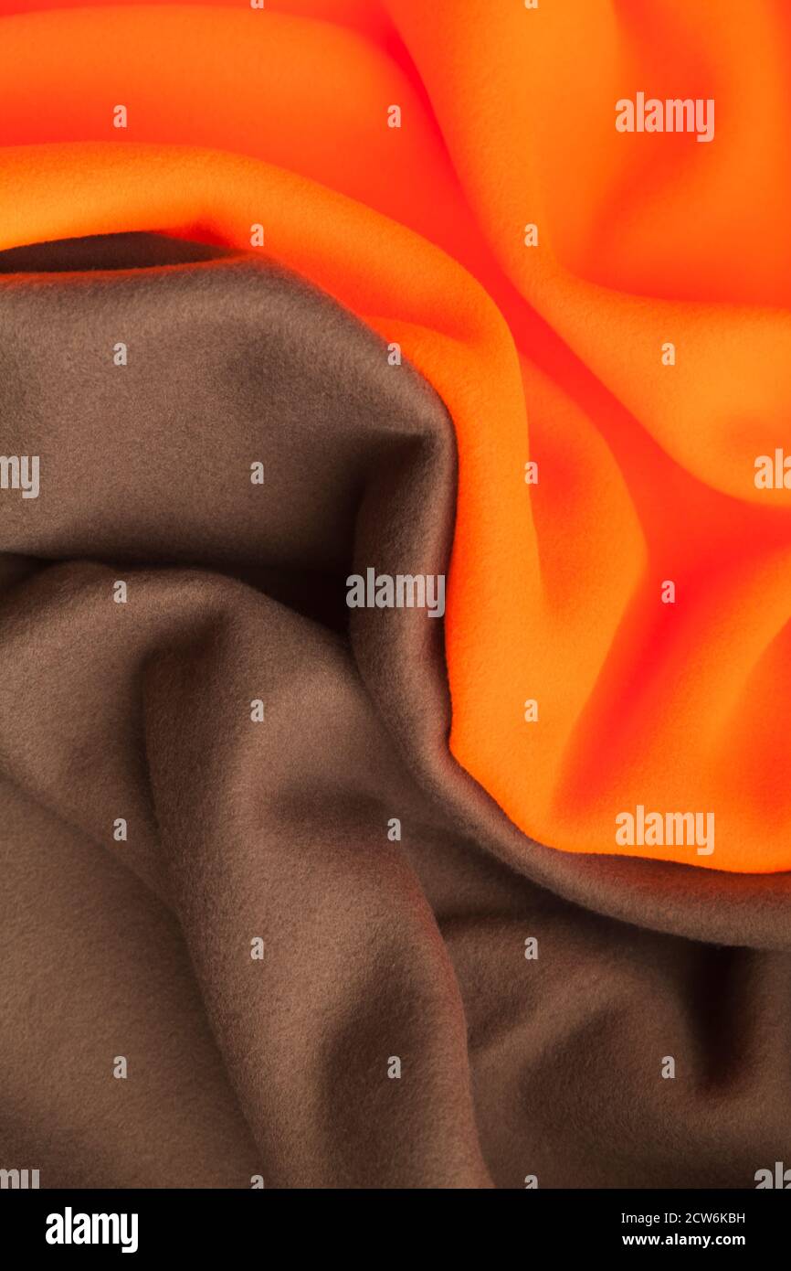 Vertical background texture of bright orange and brown fleece, soft ...