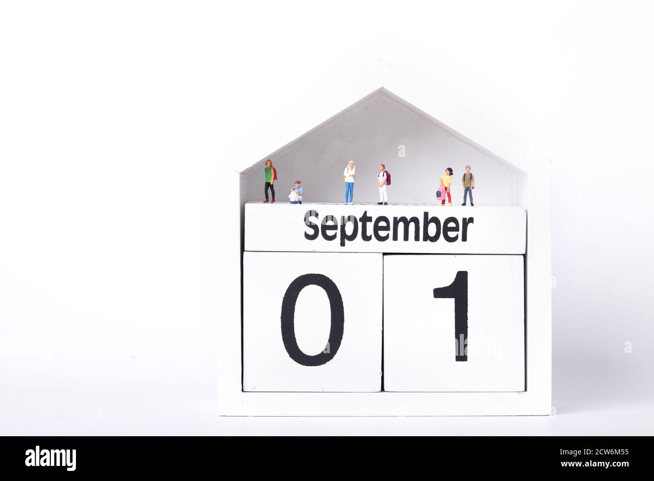 First day of school. Figurines of students standing on a calendar ...