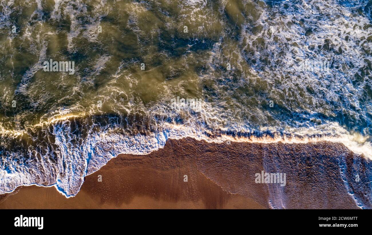 Aerial view waves on sand beach. Sea waves on the beautiful beach ...