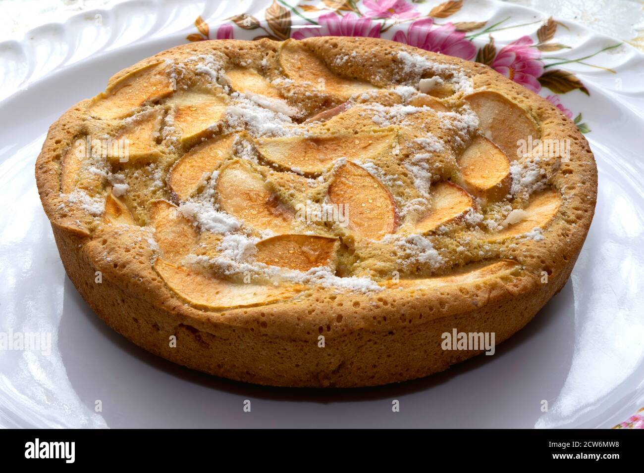 Cooking Sponge Cake with Apples, Charlotte, Apple pie lies on a platter ...