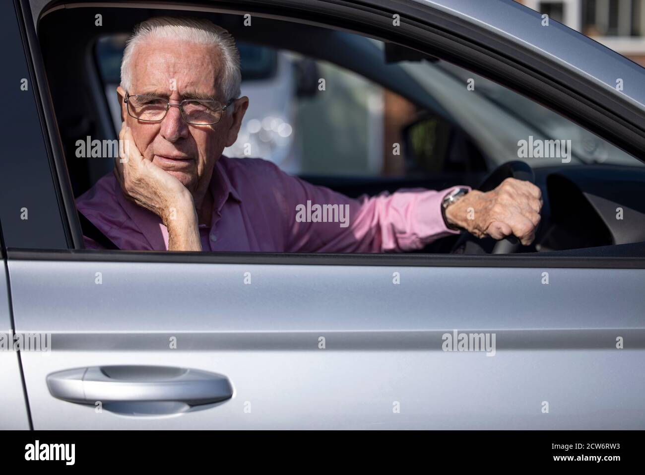 Worried Senior Male Driver Looking Out Of Car Window Stock Photo - Alamy