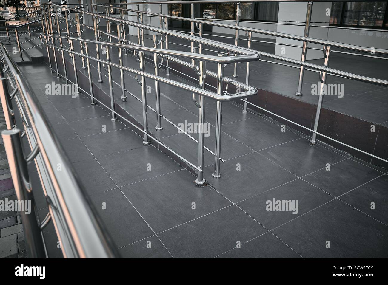 Ramp for people with disabilities and chrome railings Stock Photo - Alamy