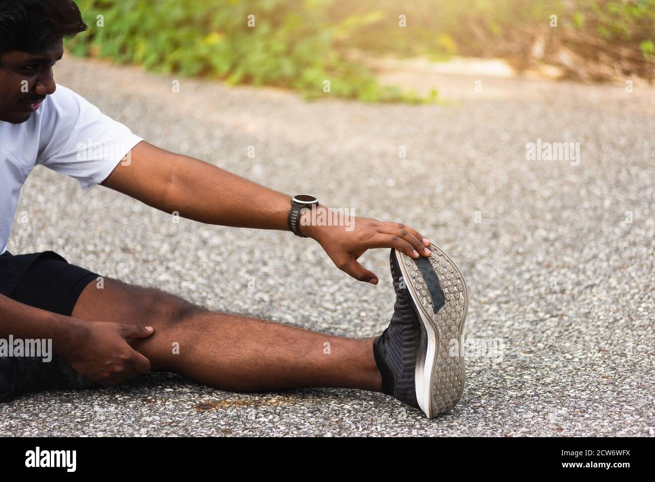 Close up Asian young athlete sport runner black man wear watch he ...