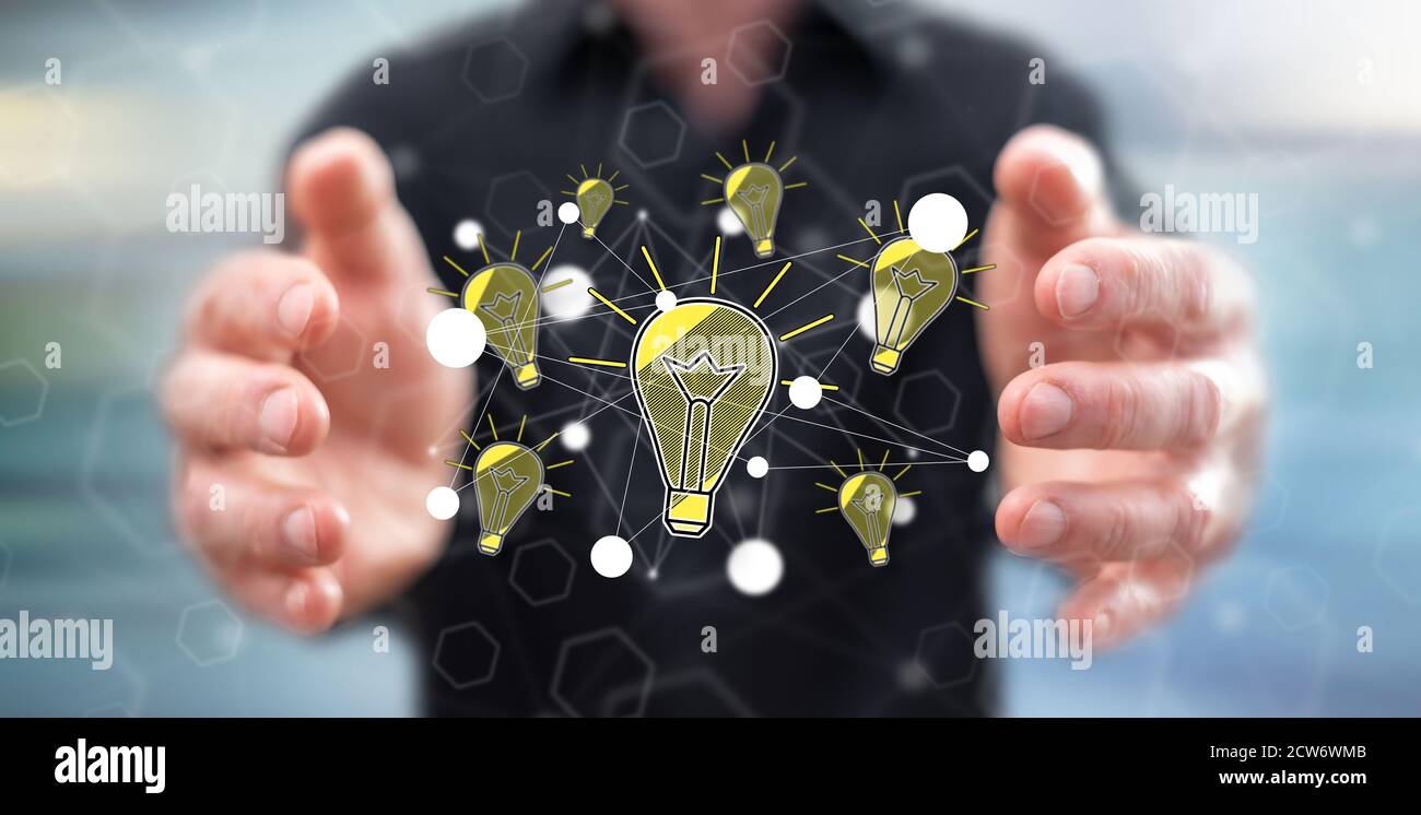 Innovation concept between hands of a man in background Stock Photo - Alamy