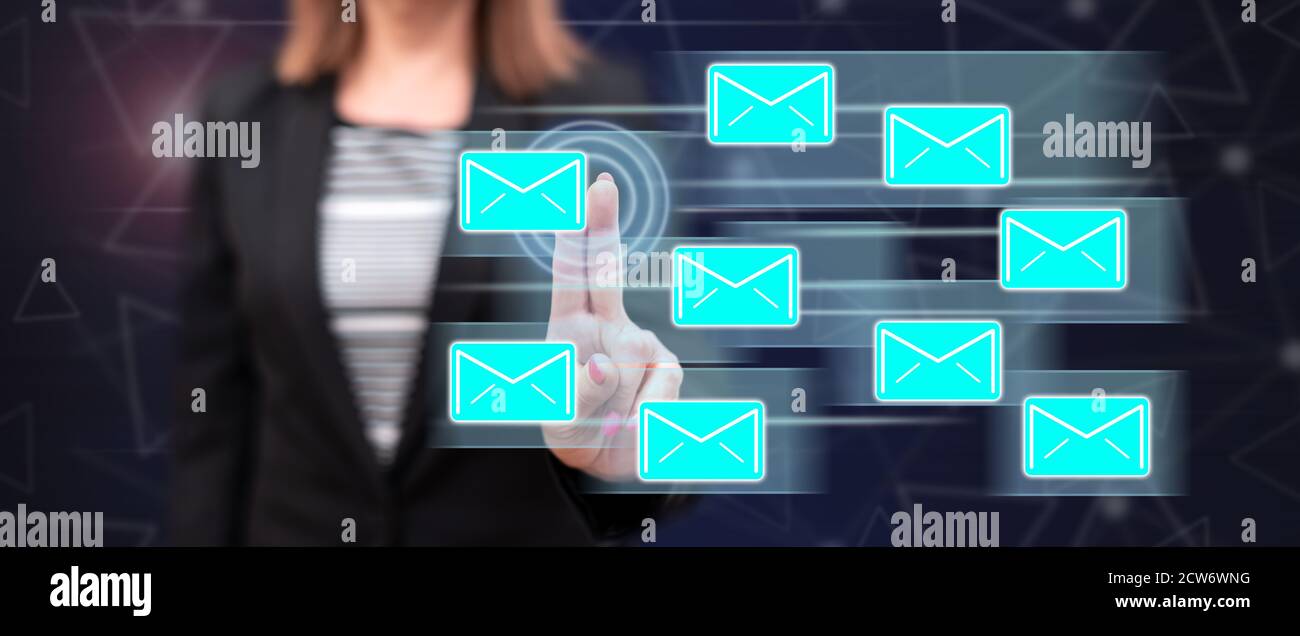 Woman touching an email sending concept on a touch screen with her ...