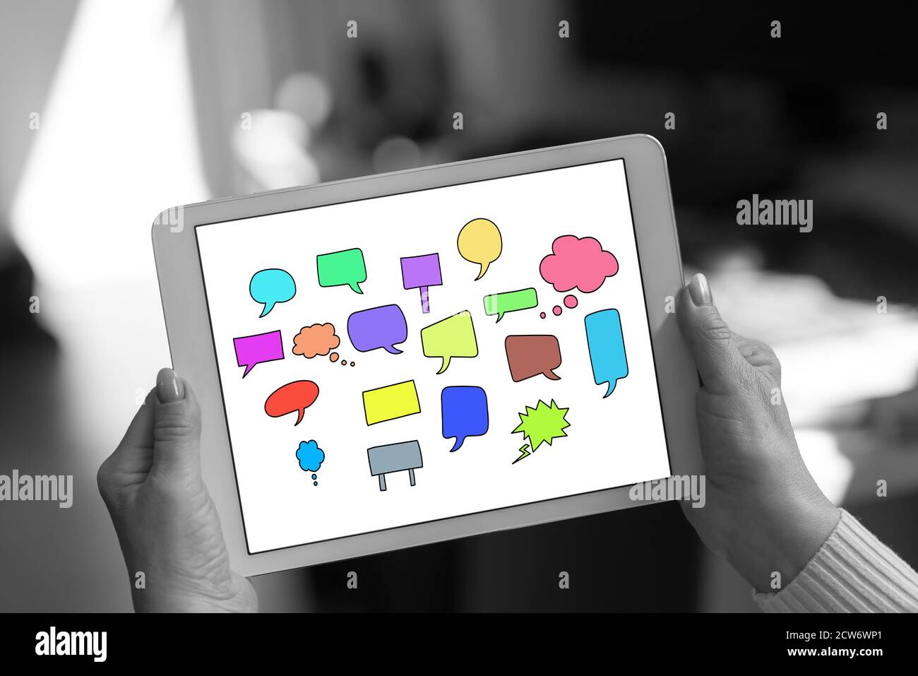 Communication concept shown on a tablet held by a woman Stock Photo - Alamy
