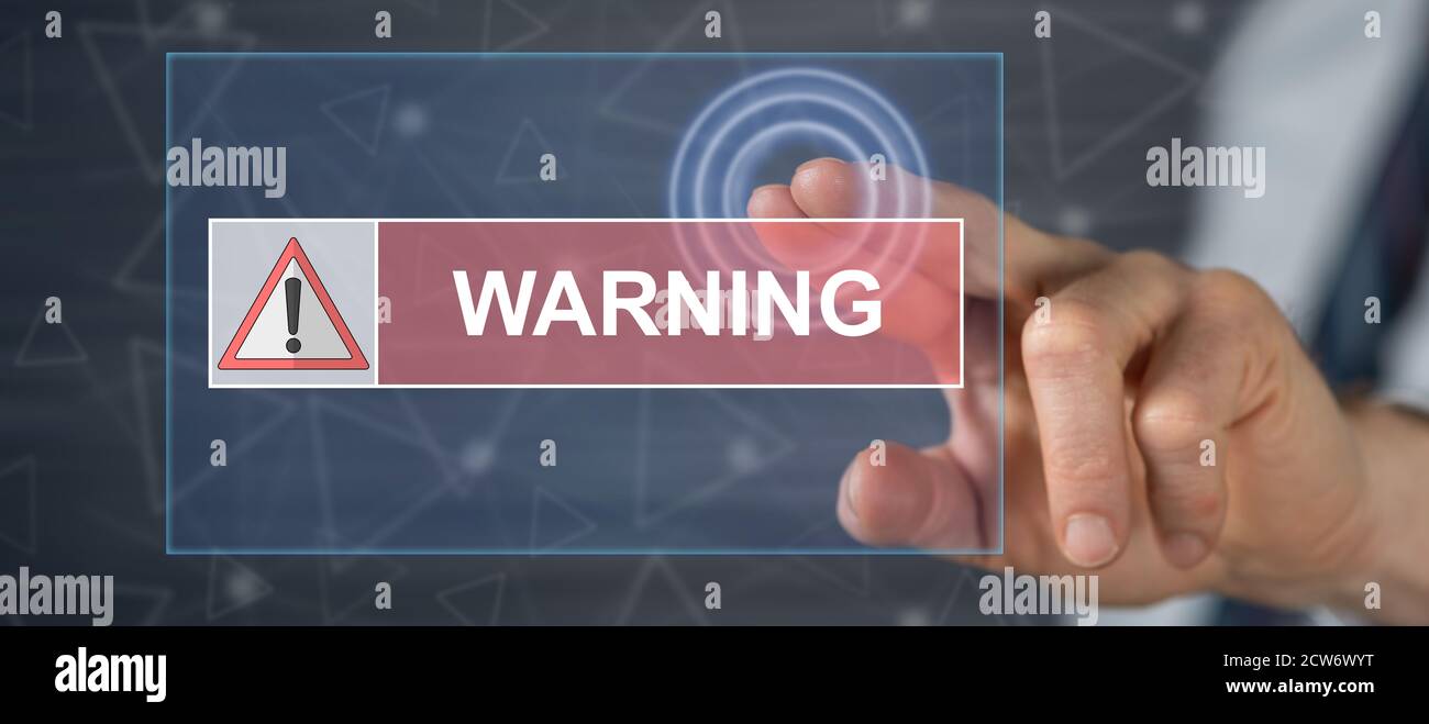 Man touching a warning concept on a touch screen with his finger Stock ...