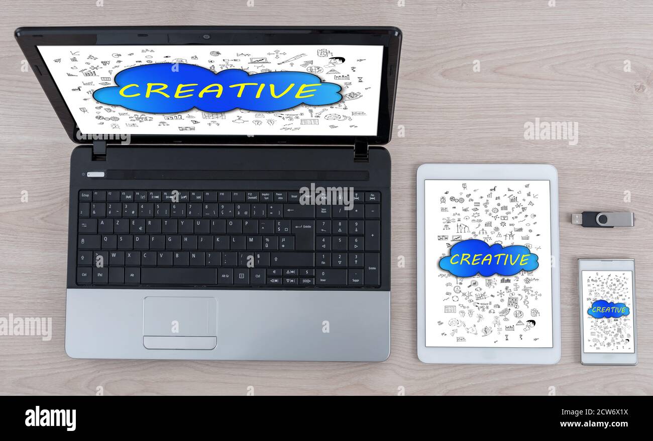 Creativity concept shown on different information technology devices ...