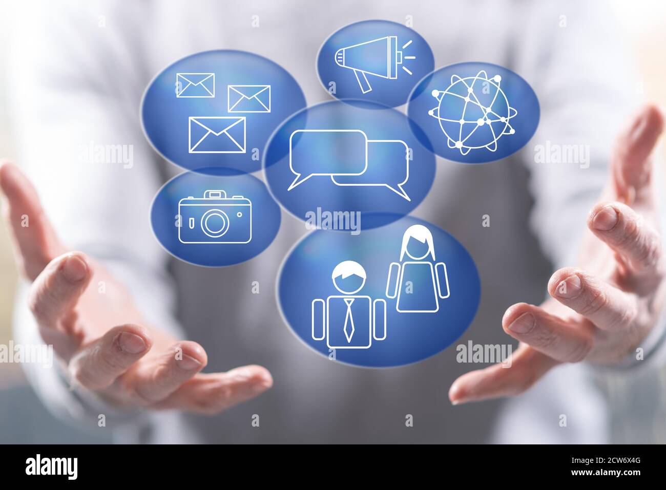 Social marketing concept above the hands of a man in background Stock ...