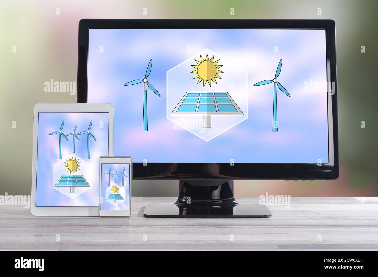 Clean energy concept shown on different information technology devices ...