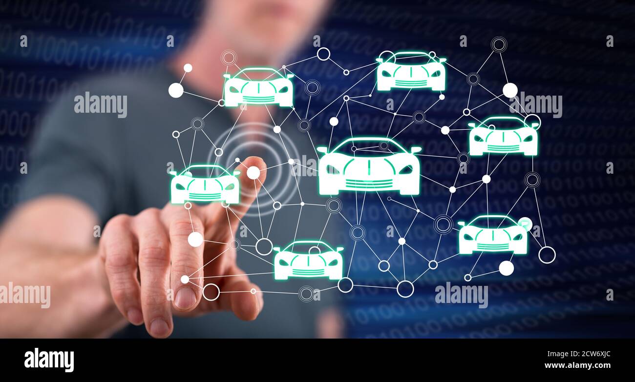 Man touching a smart car concept on a touch screen with his finger ...