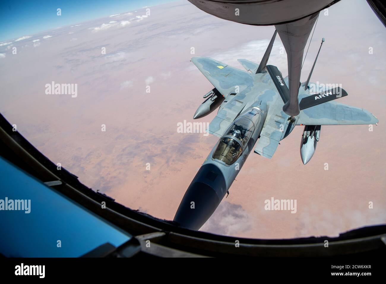 A U.S. Air Force KC-135 Stratotanker conducts an aerial refueling with ...