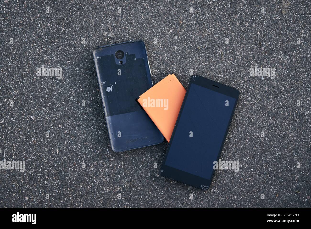 Damaged smartphone with broken touch screen on the asphalt Stock Photo ...