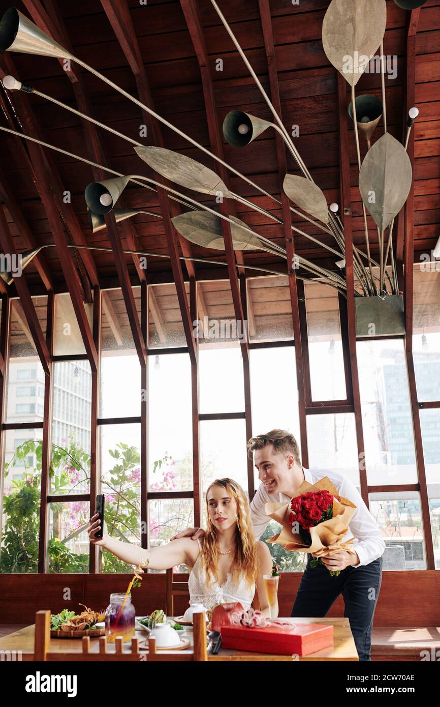 Couple taking romantic cafe Stock Photo - Alamy