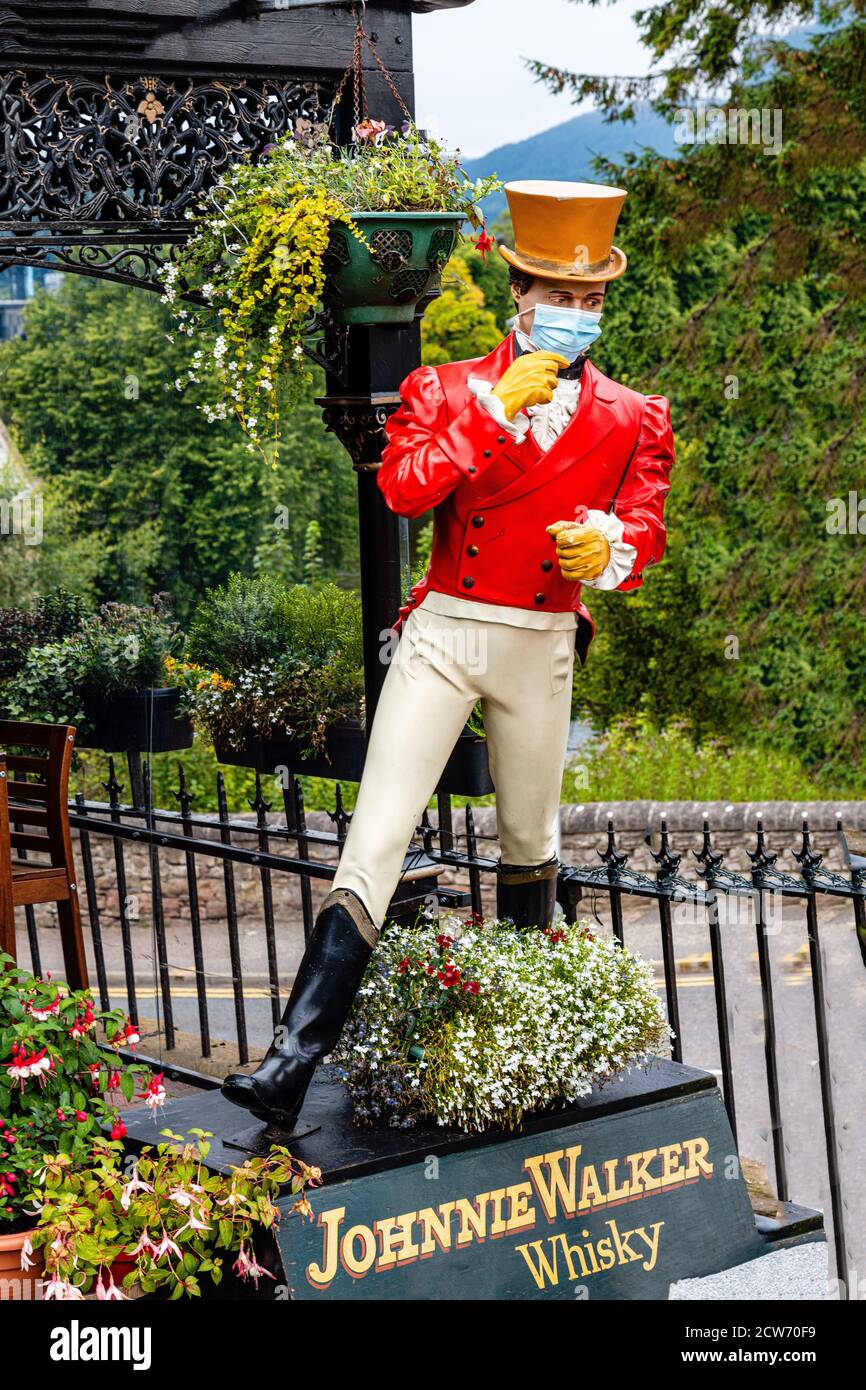 Johnnie walker figure wearing mask hi-res stock photography and images ...