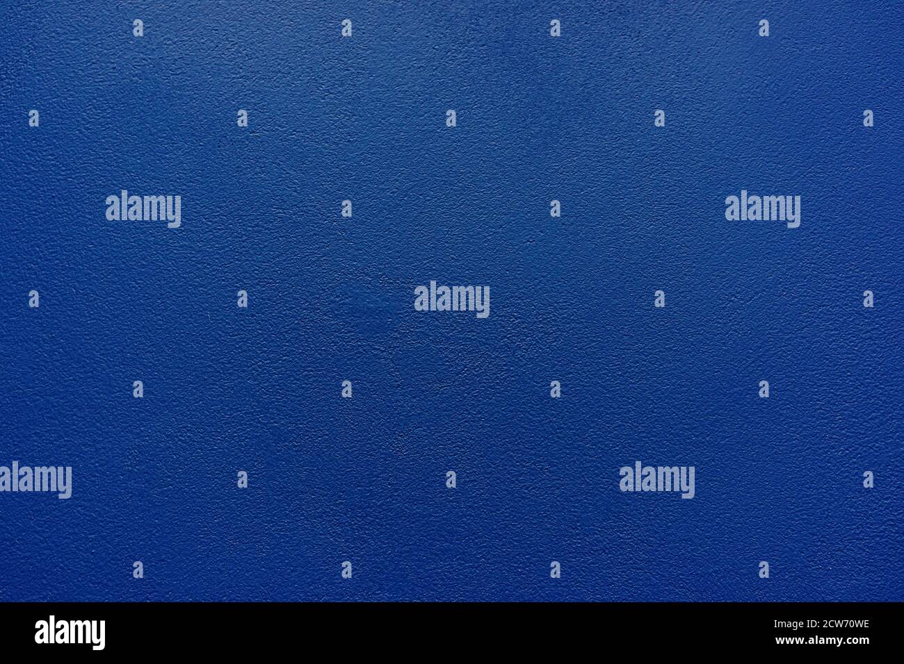 Plaster surface of the wall painted in blue. For design Stock Photo - Alamy