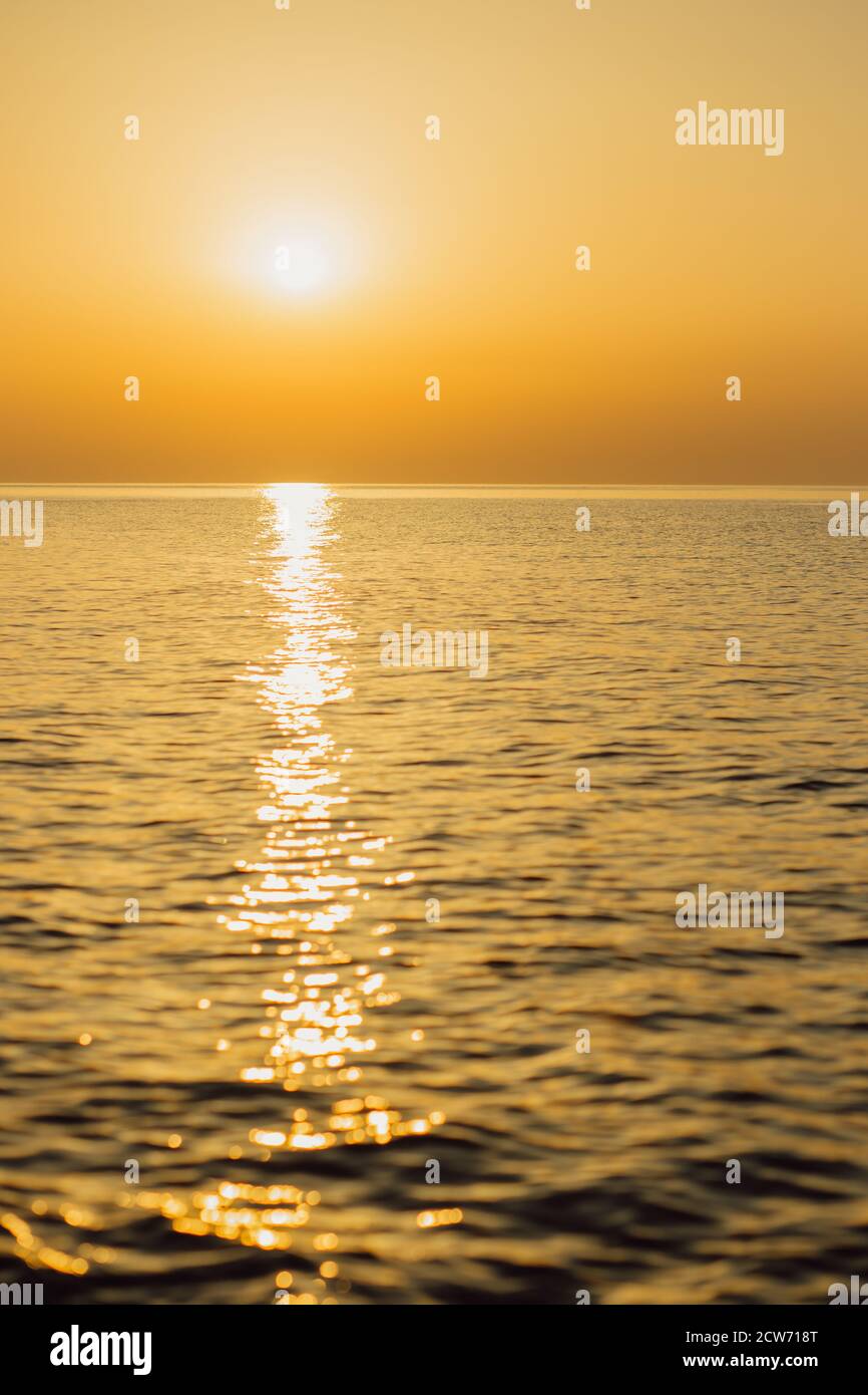 Sunny path on the sunset sea Stock Photo - Alamy