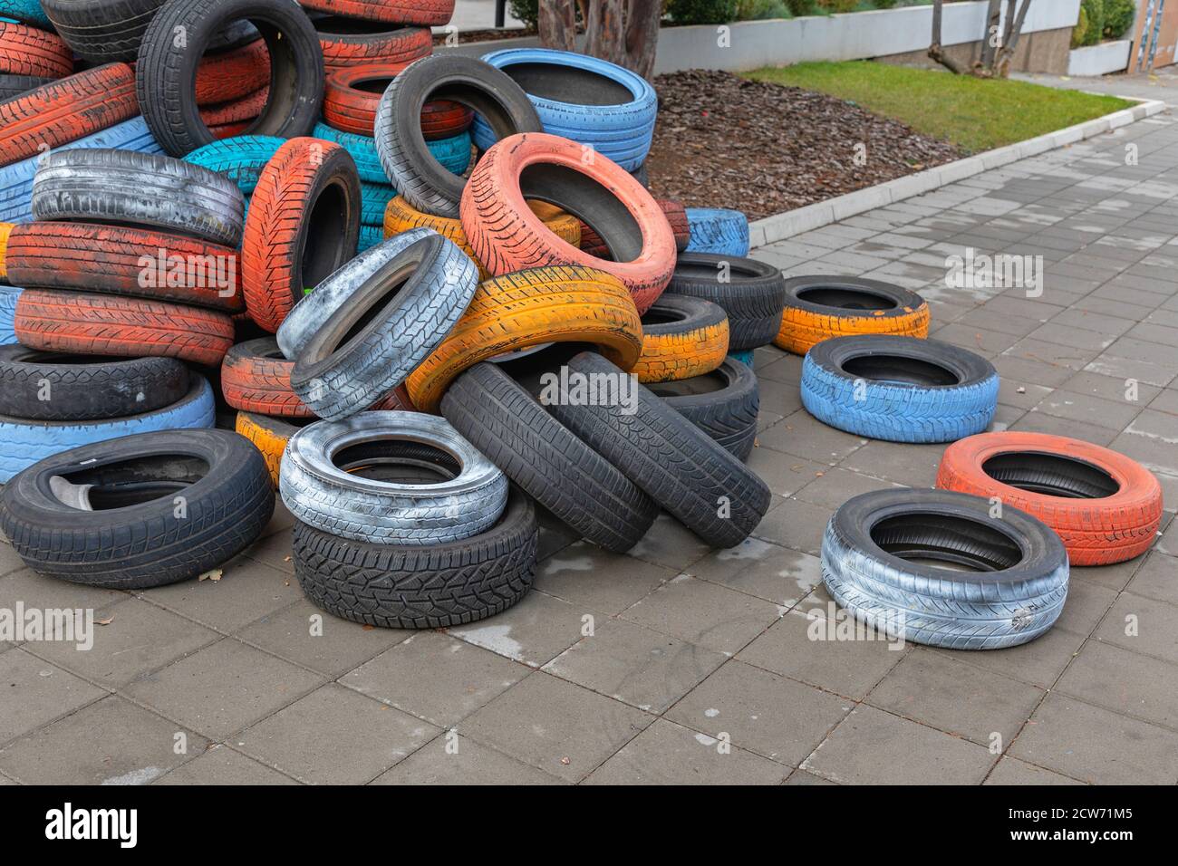 Big Bunch of Colourful Used Car Tyres Stock Photo - Alamy