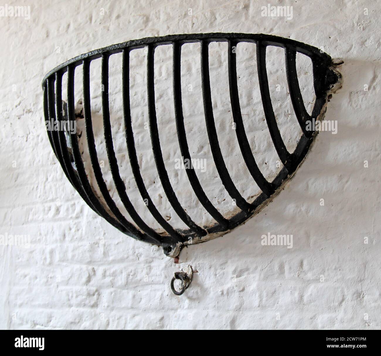 A Traditional Half Round Wall Mounted Hay Rack Stock Photo - Alamy