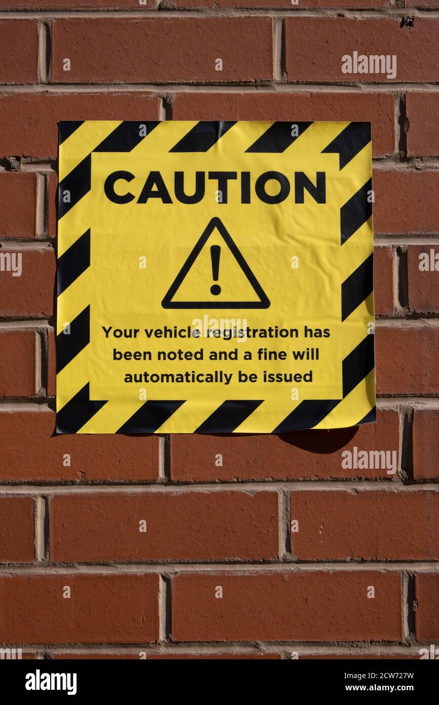 caution warning fine sign on wall in Bolton Lancashire July 2020 Stock ...