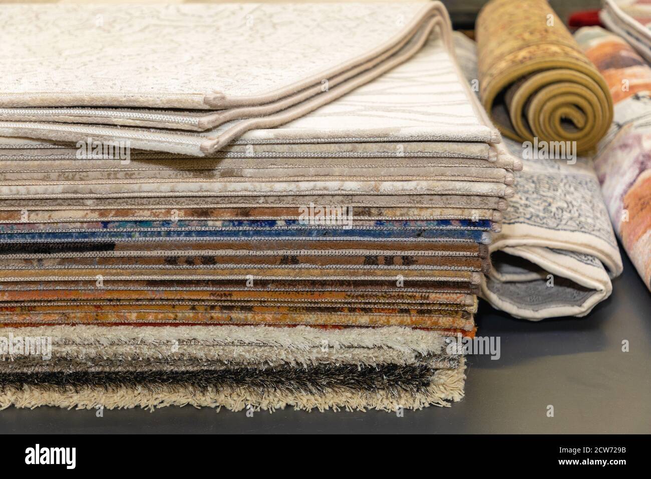 Stacked Layers of Carpets and Rugs Variety Selection Stock Photo - Alamy