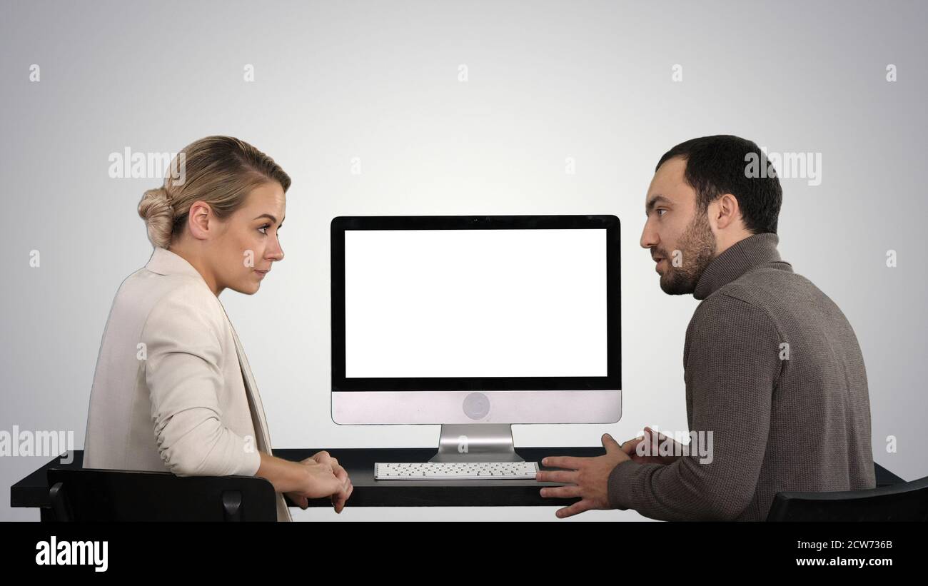 People working around a computer hi-res stock photography and images ...