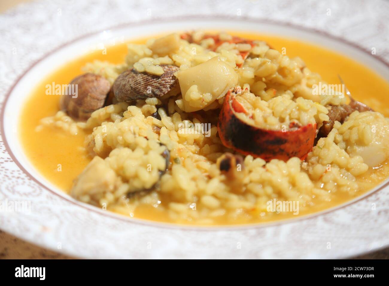 Seafood spanish rice with lobster and clams Stock Photo - Alamy