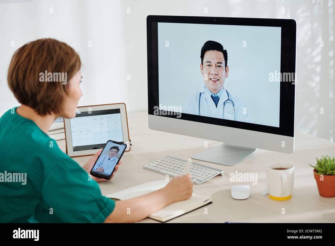 Female surgeon video calling Stock Photo - Alamy
