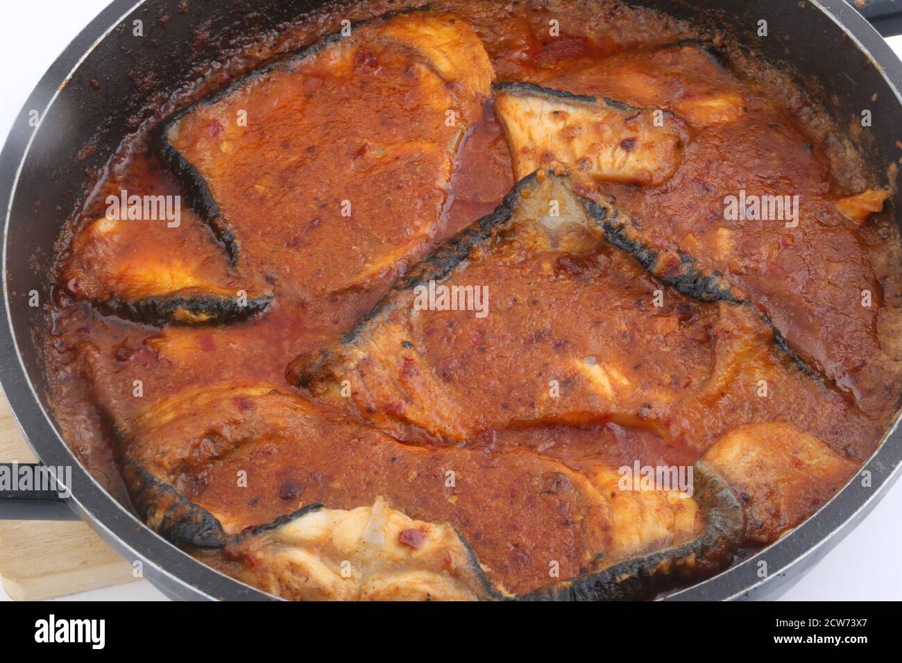 small shark fish cooked with sauce Stock Photo - Alamy