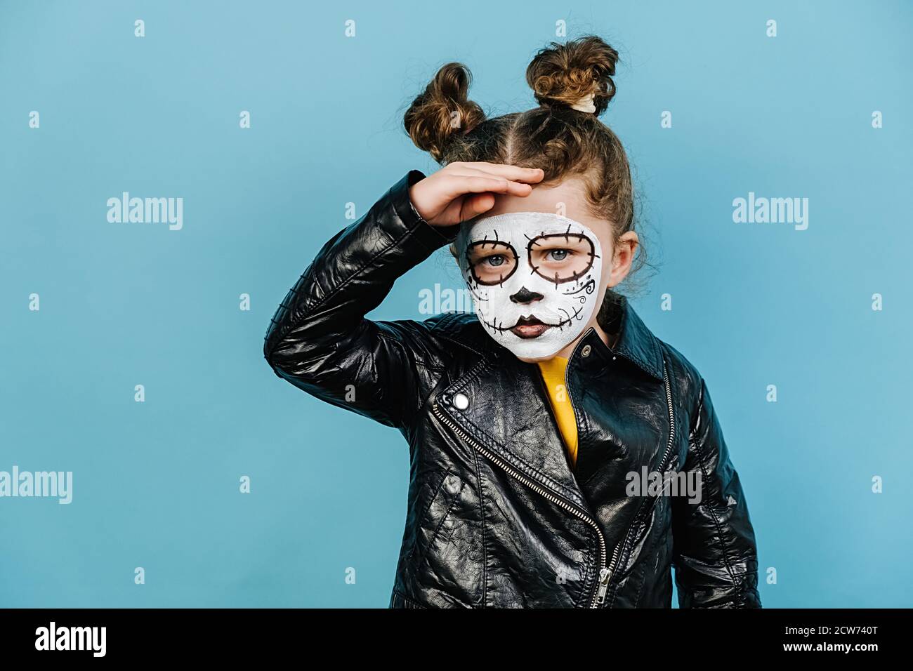 Angry little girl with serious expression, focused into distance, keeps ...