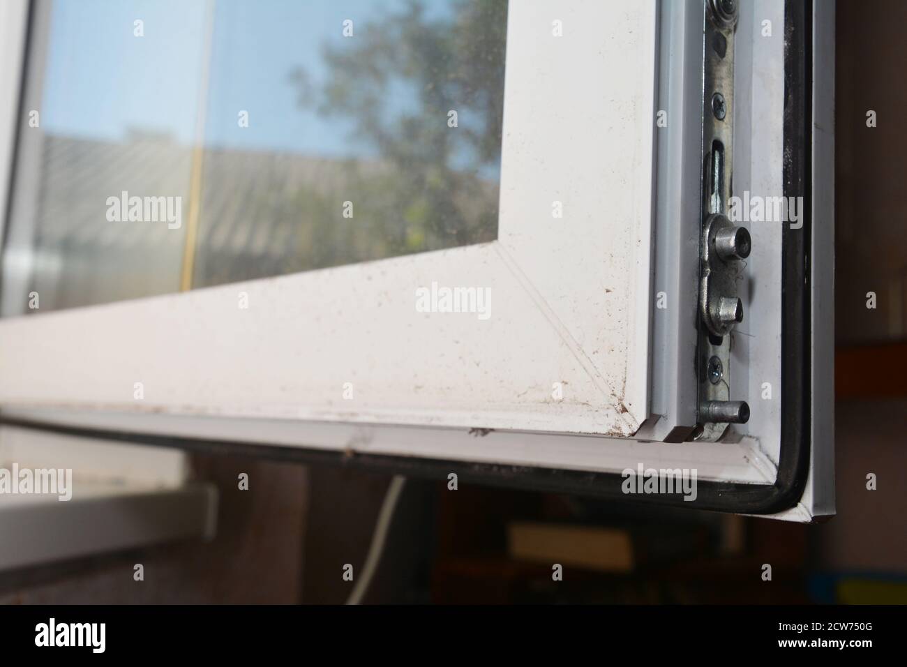 A close-up on a plastic window profile corner with a locking mechanism ...
