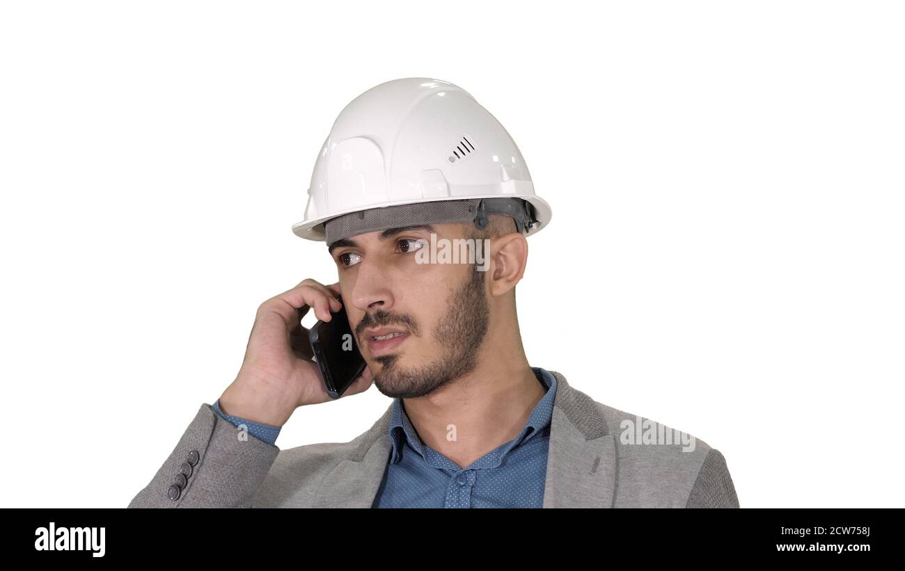 Engineer talking a mobile phone inspecting construction work of crane ...