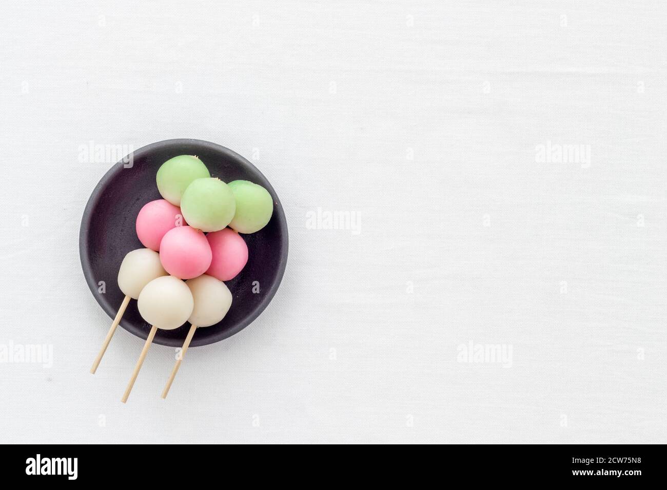 Japanese three colored dumplings Dango on plate, top view Stock Photo ...