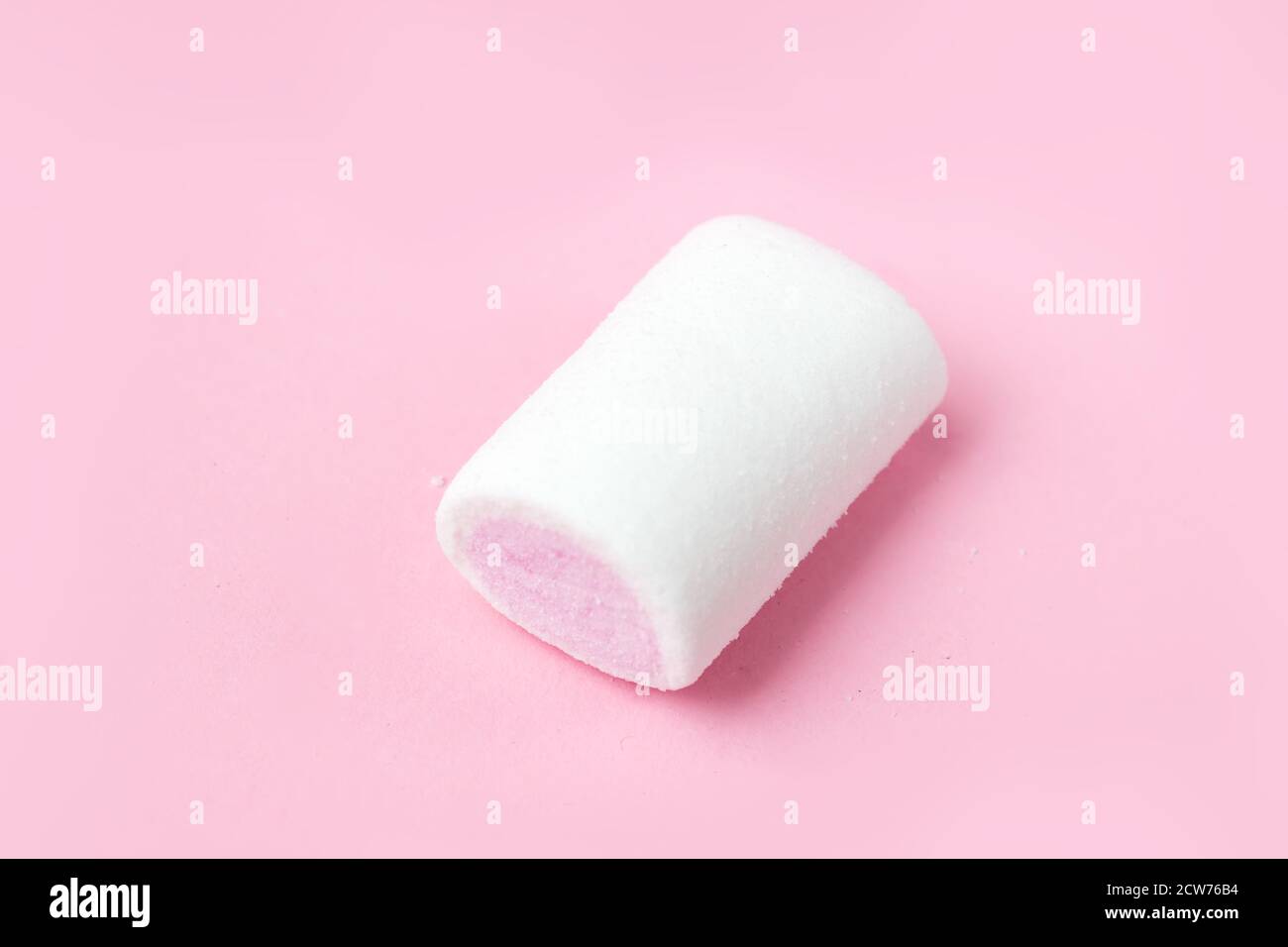 White-pink marshmallows placing on pink flatlay. Marshmallow pastel ...