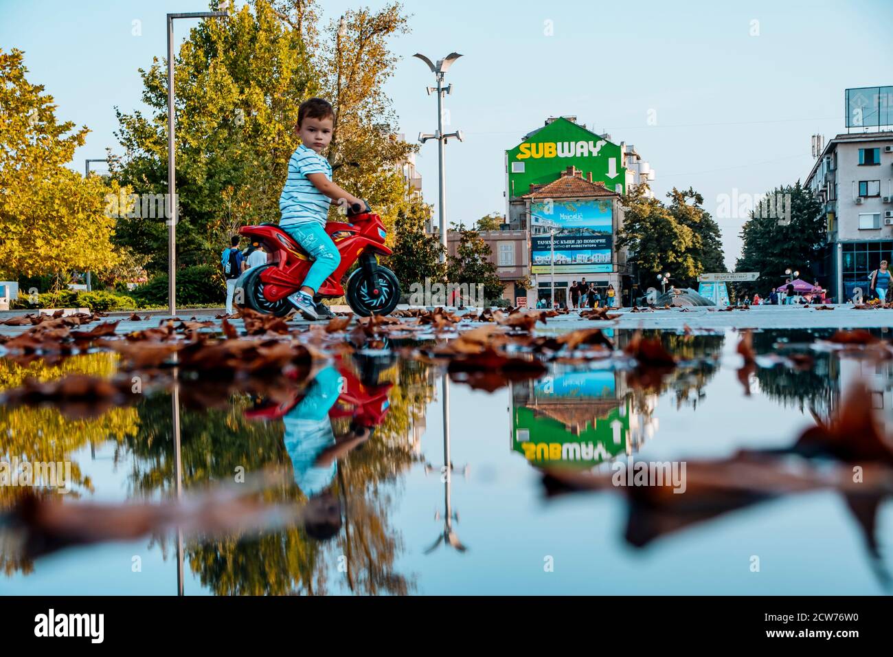 Back view boy on bicycle hi-res stock photography and images - Alamy