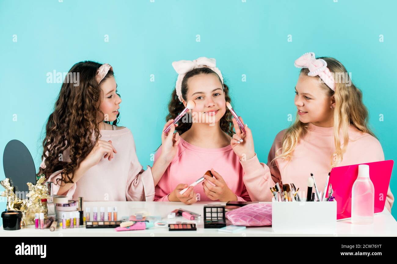 Happy girls doing makeup together. Sisterhood happiness. Cosmetics shop ...