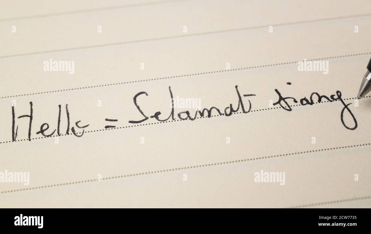 Beginner Indonesian language learner writing Hello formal word Selamat ...